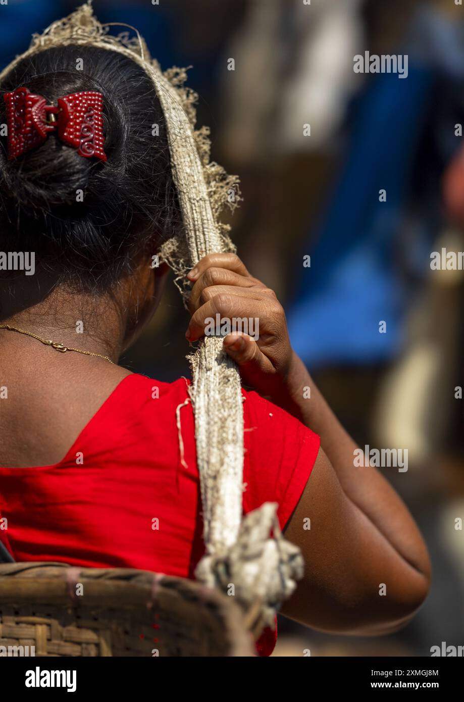 Chakma tribe woman carrying a basket with a strap on her head ...