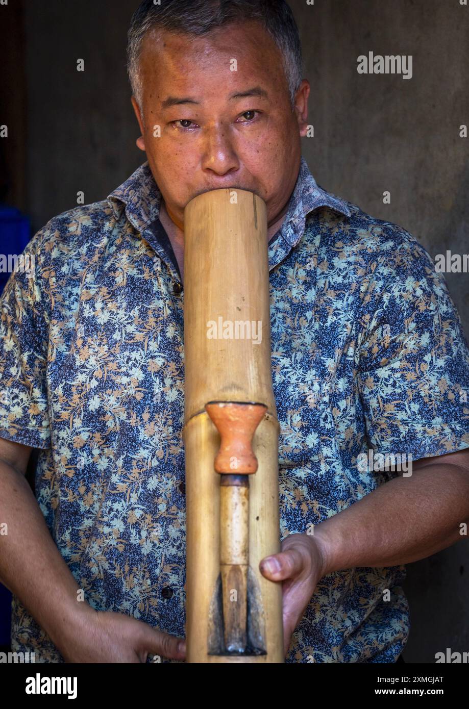 Chakma tribe man smoking bamboo pipe, Chittagong Division, Rangamati ...