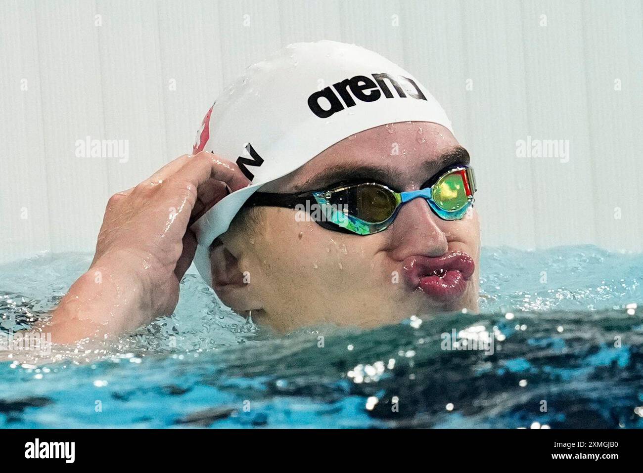 Thierry Bollin, of Switzerland, reacts after competing in a heat in the ...