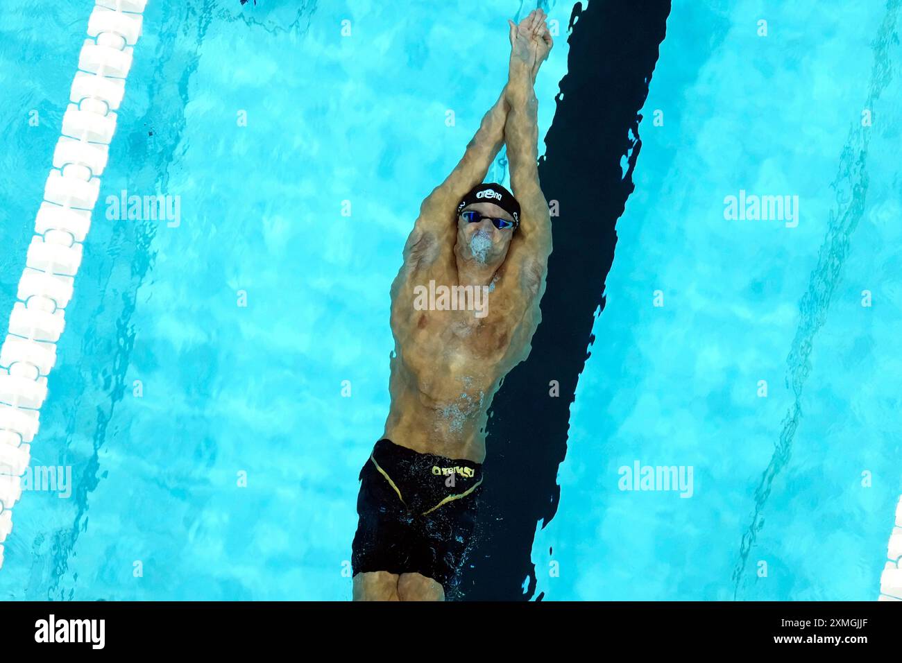 Thomas Ceccon, of Italy, competes during a heat in the men's 100-meter ...