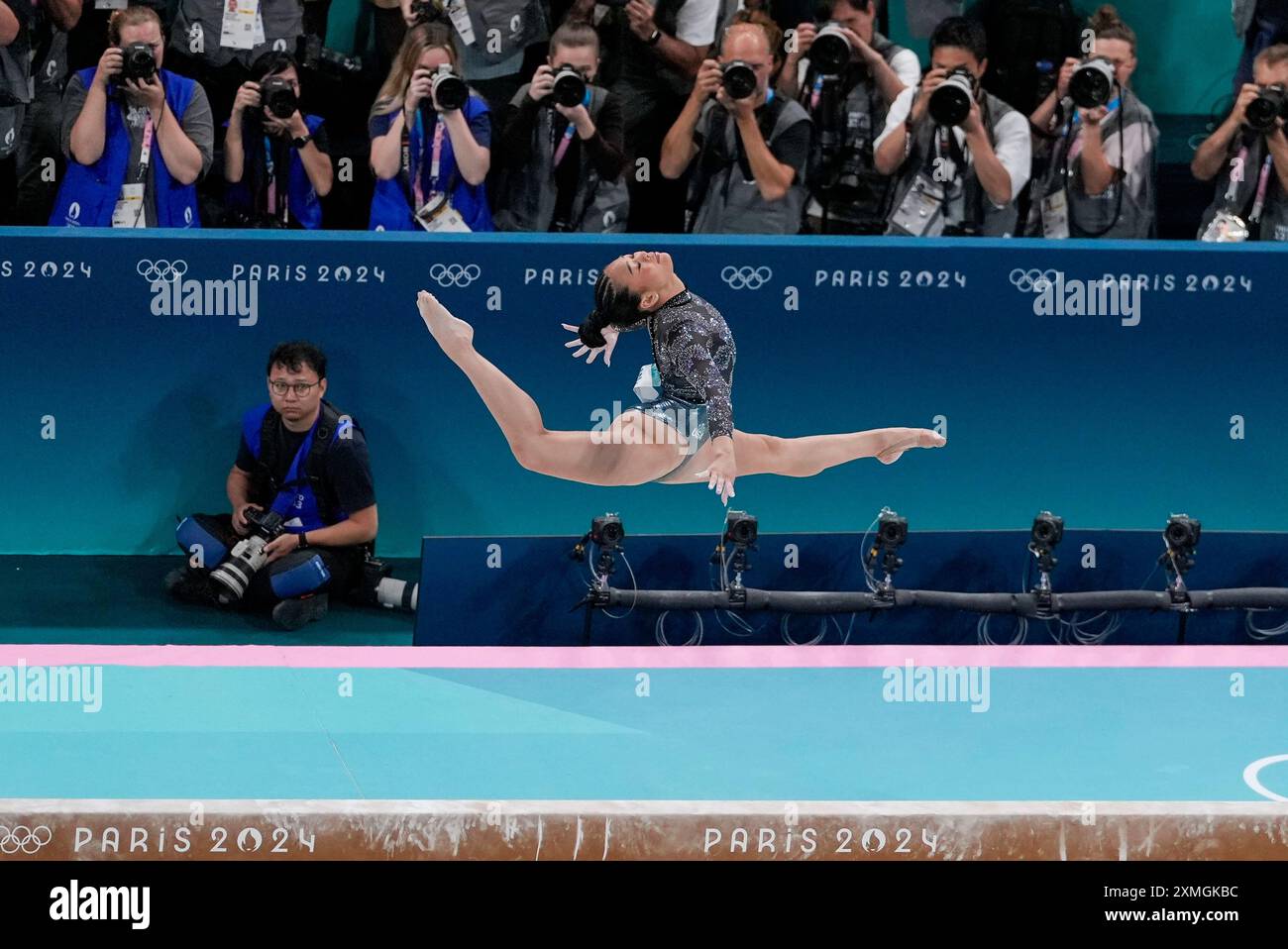 Sunisa Lee, of United States, performs on the beam during a women's ...