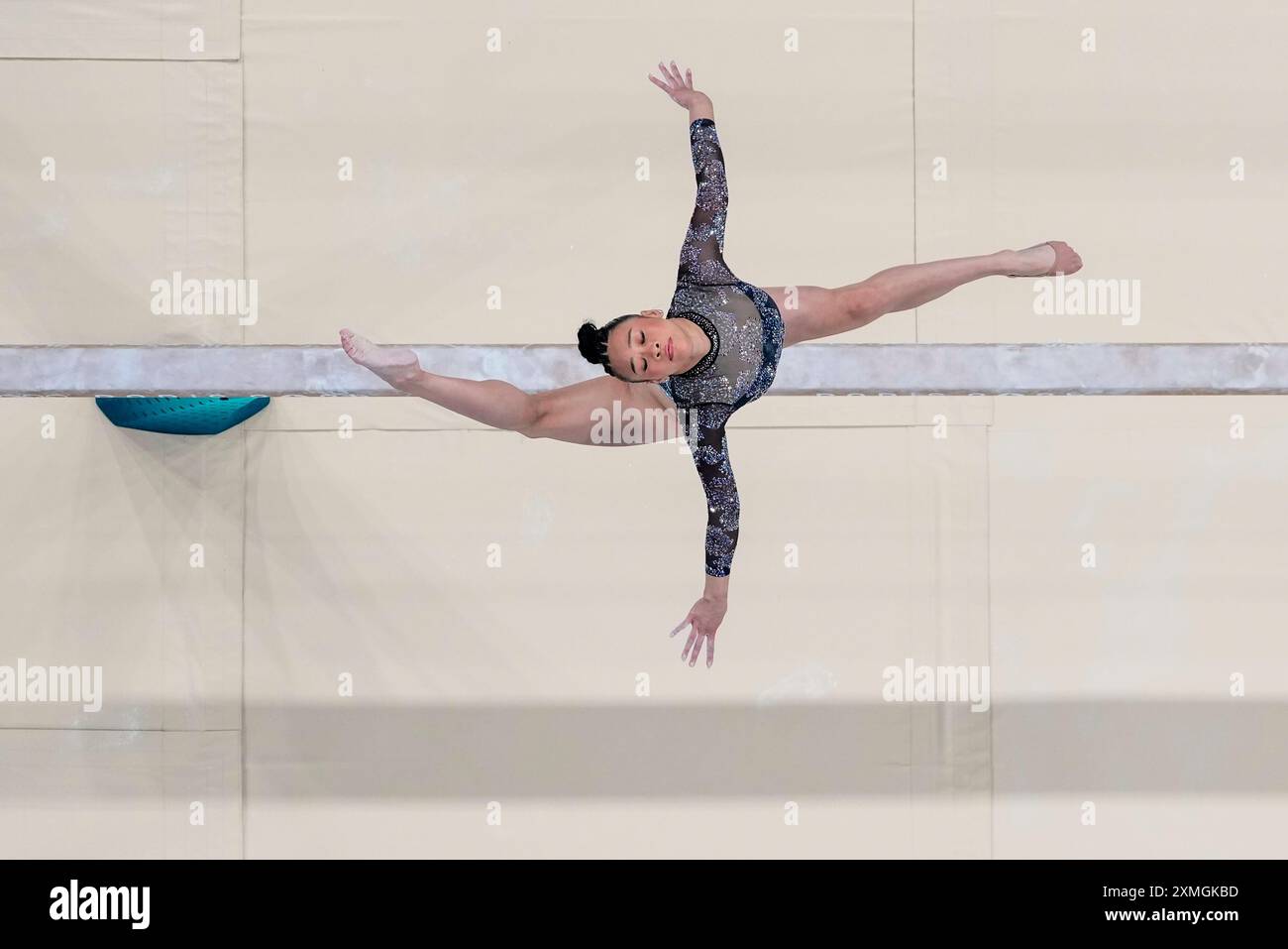 Sunisa Lee, of United States, performs on the beam during a women's ...