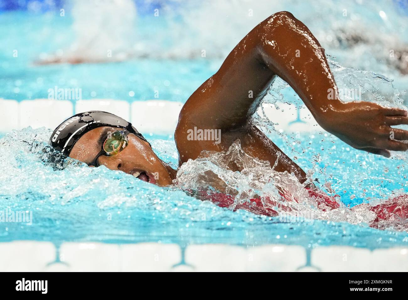 Dhinidhi Desinghu, of India, competes during a heat in the women's 200 ...