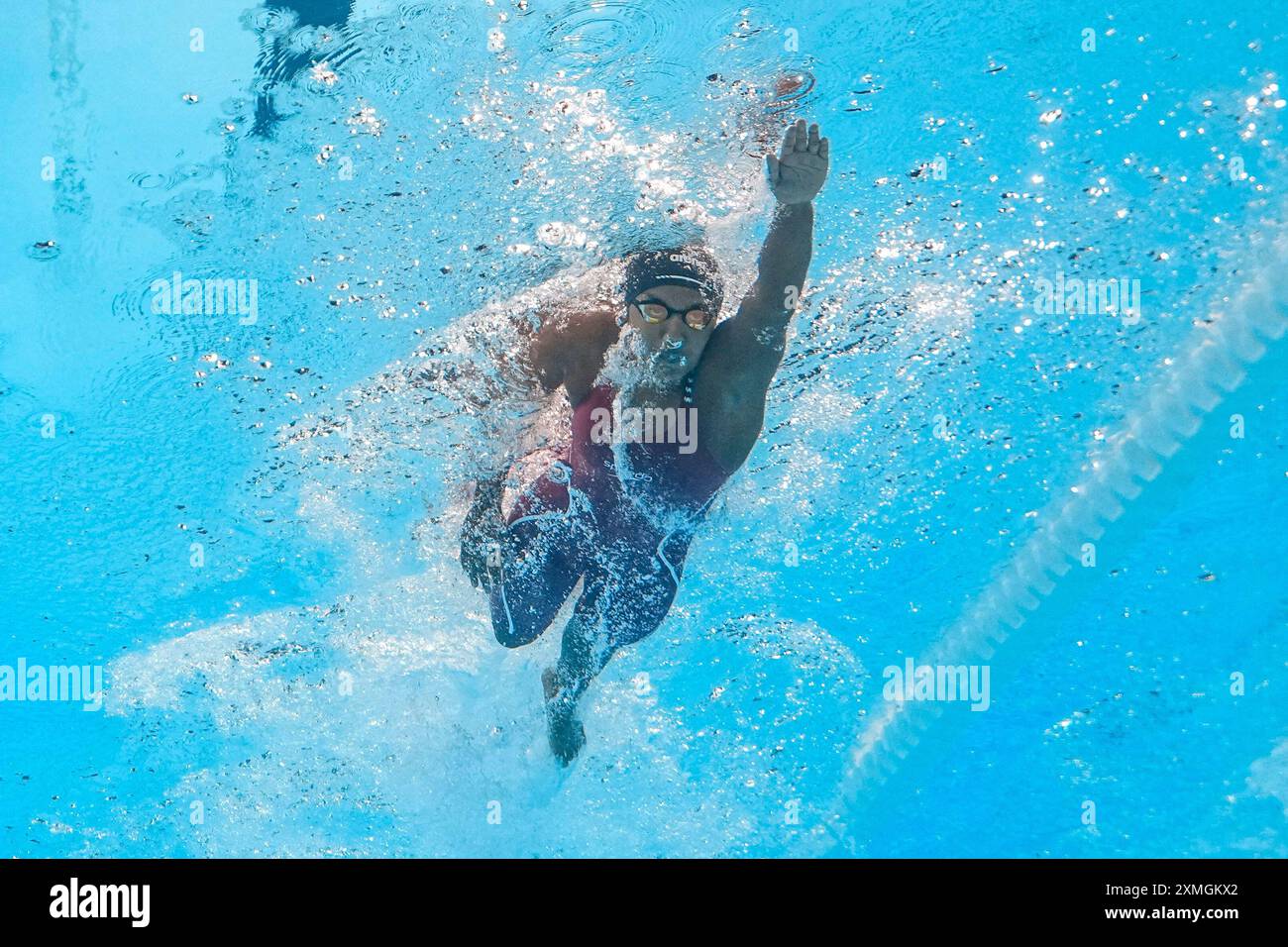 Dhinidhi Desinghu, of India, competes during a heat in the women's 200 ...