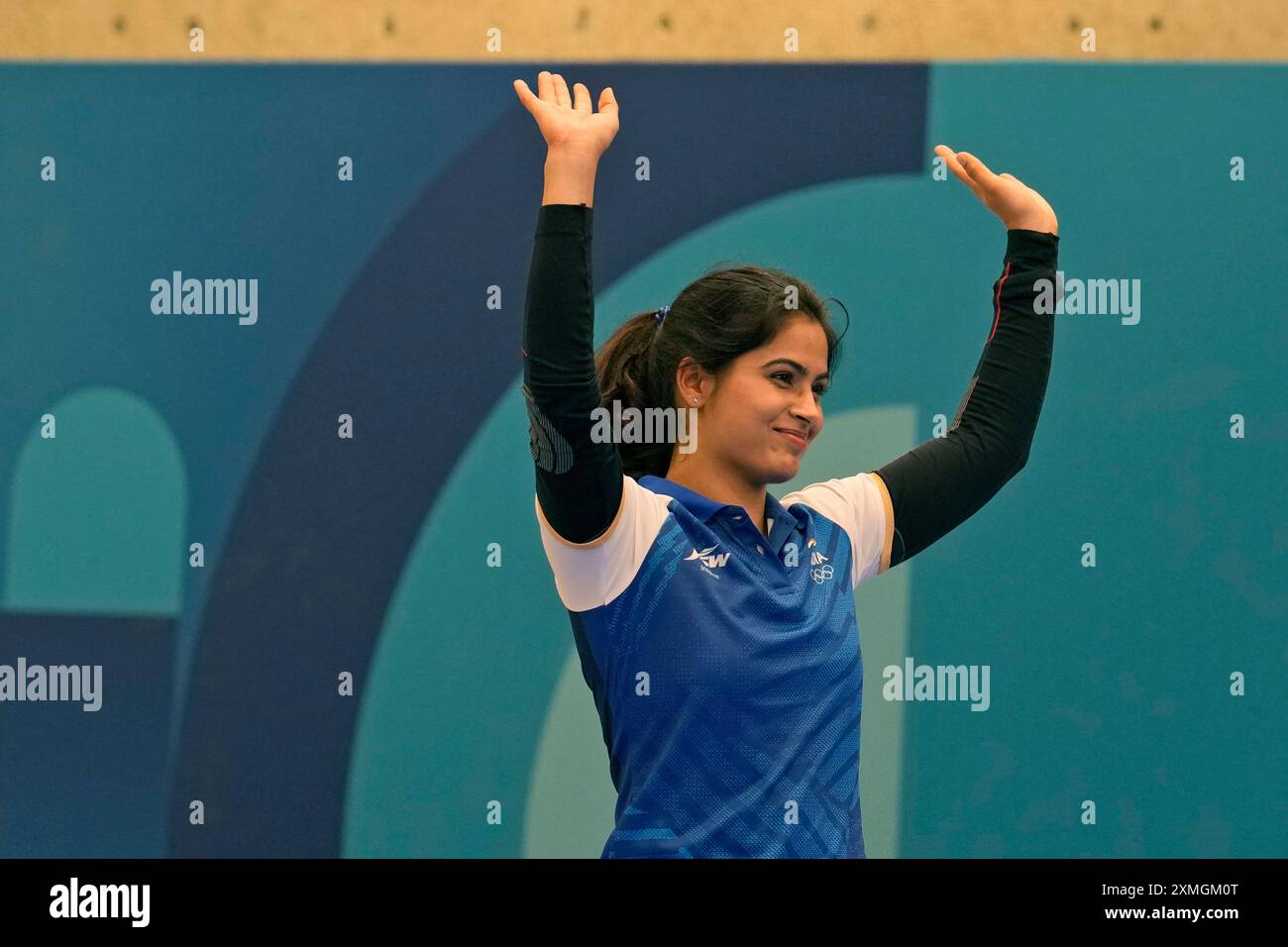 India's Manu Bhaker celebrates after winning the bronze medal in the ...