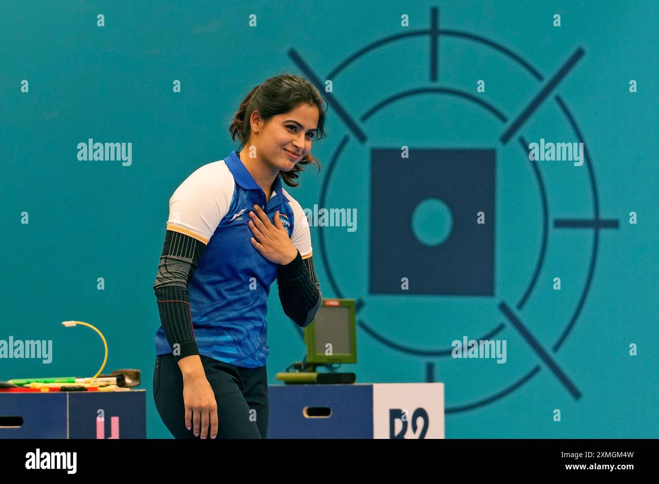India's Manu Bhaker celebrates after winning the bronze medal in the ...