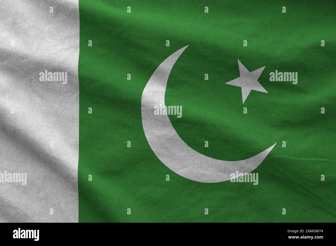 Pakistan flag depicted on folded wavy fabric of old cloth close up ...