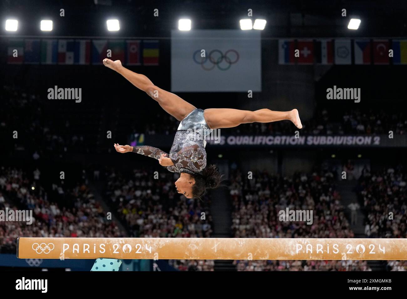Simone Biles competes on the balance beam during a women's artistic ...