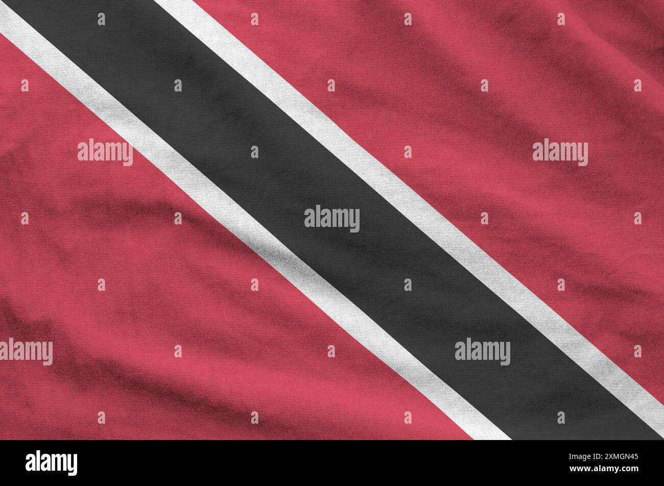Trinidad and Tobago flag depicted on folded wavy fabric of old cloth ...