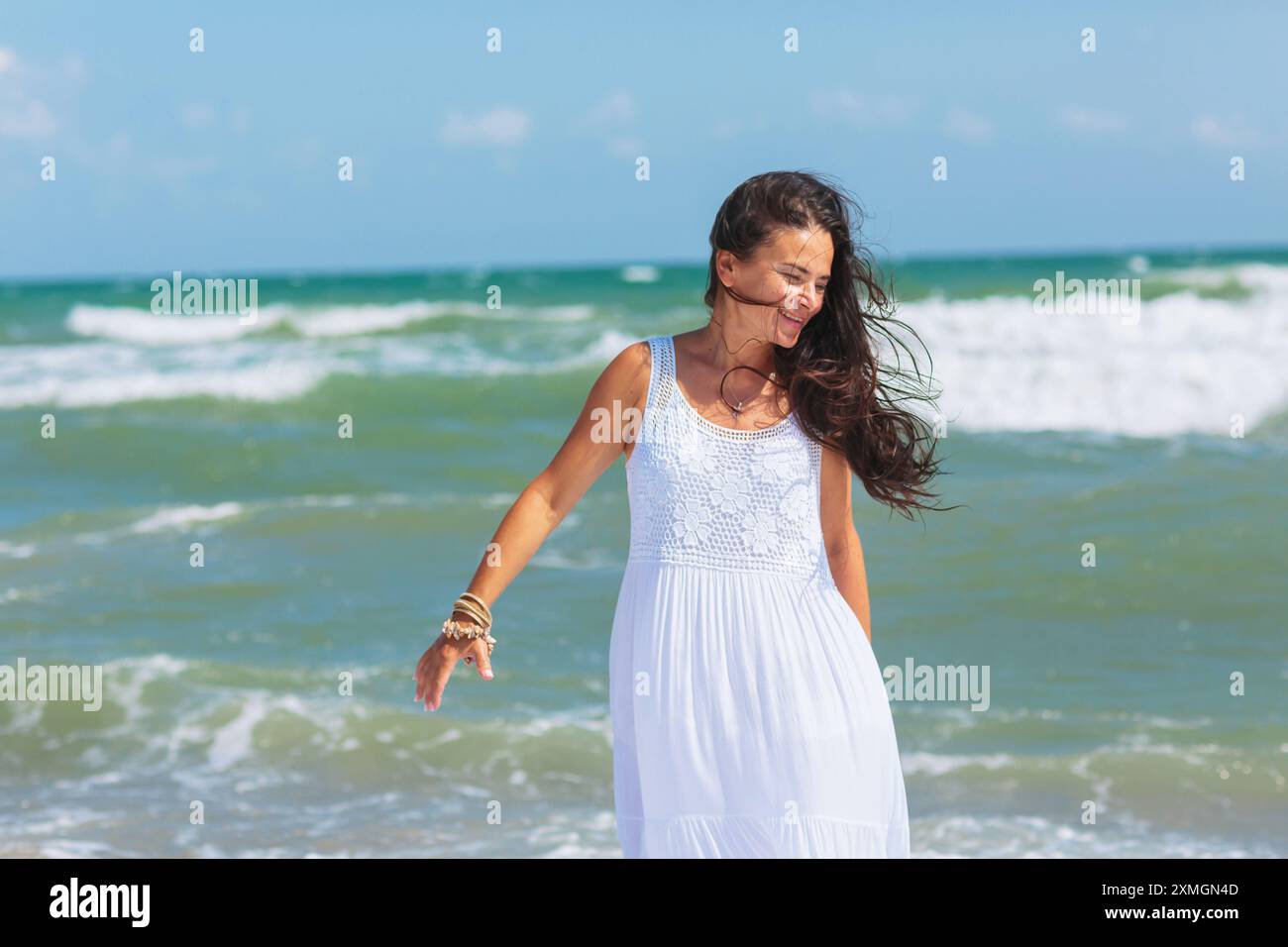 Middle-Aged Woman's Sun-soaked Walk Stock Photo - Alamy