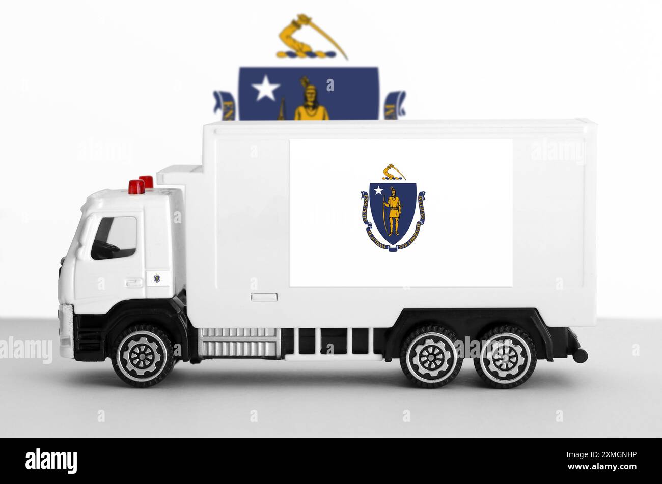 Massachusetts US state flag depicted on side wall of white delivery van ...