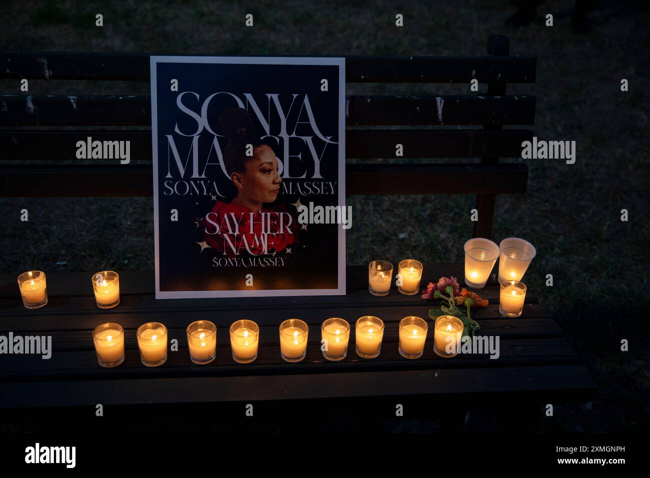 Mourners put up candles while attending a vigil for Sonya Massey in ...