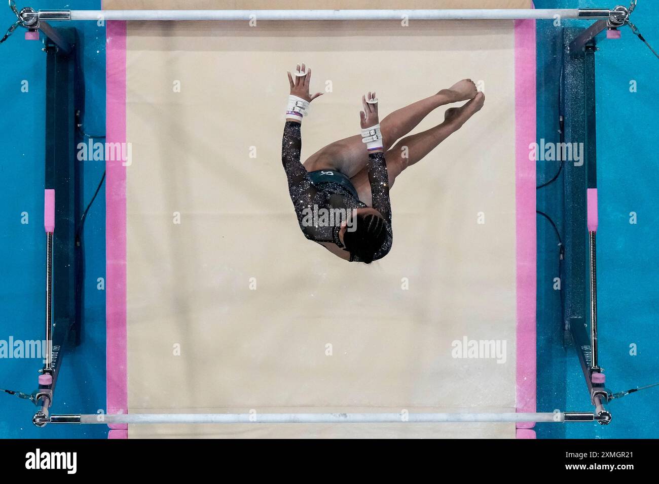 Sunisa Lee, of United States, performs on the uneven bars during a ...