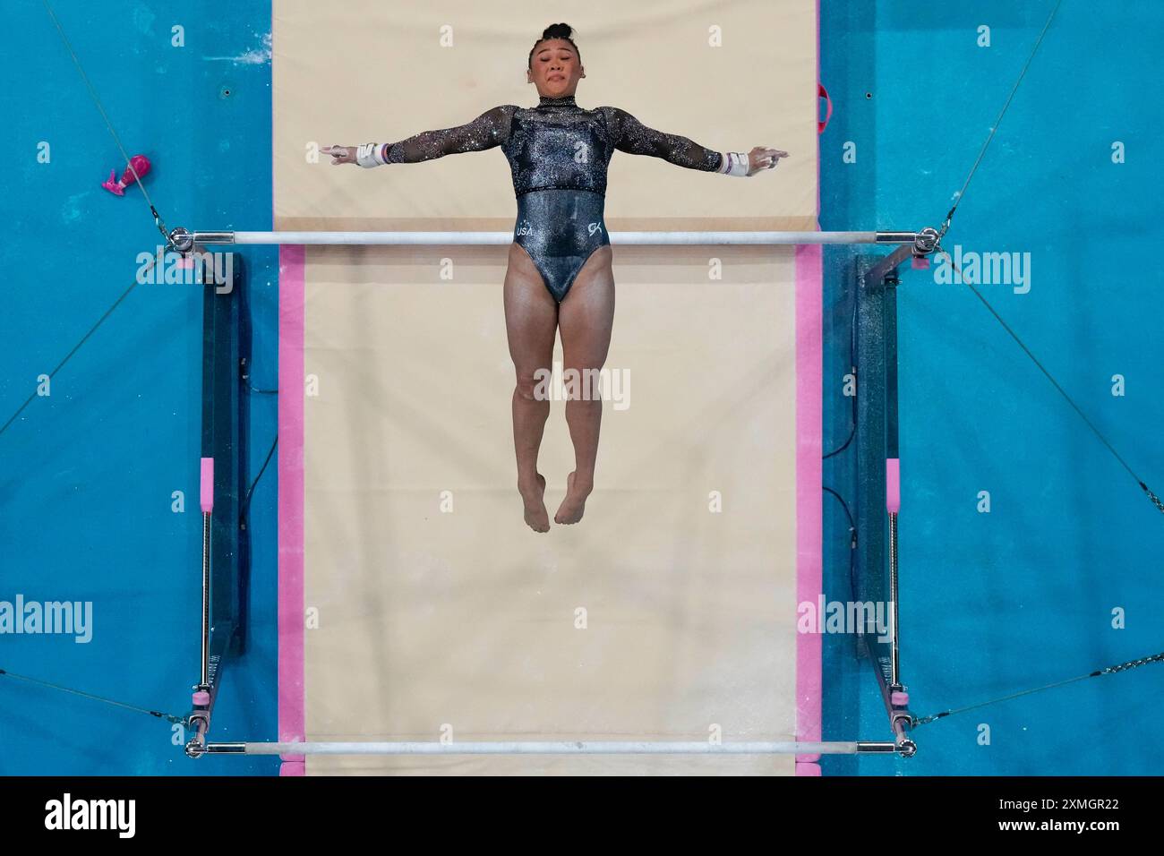 Sunisa Lee, of United States, performs on the uneven bars during a ...