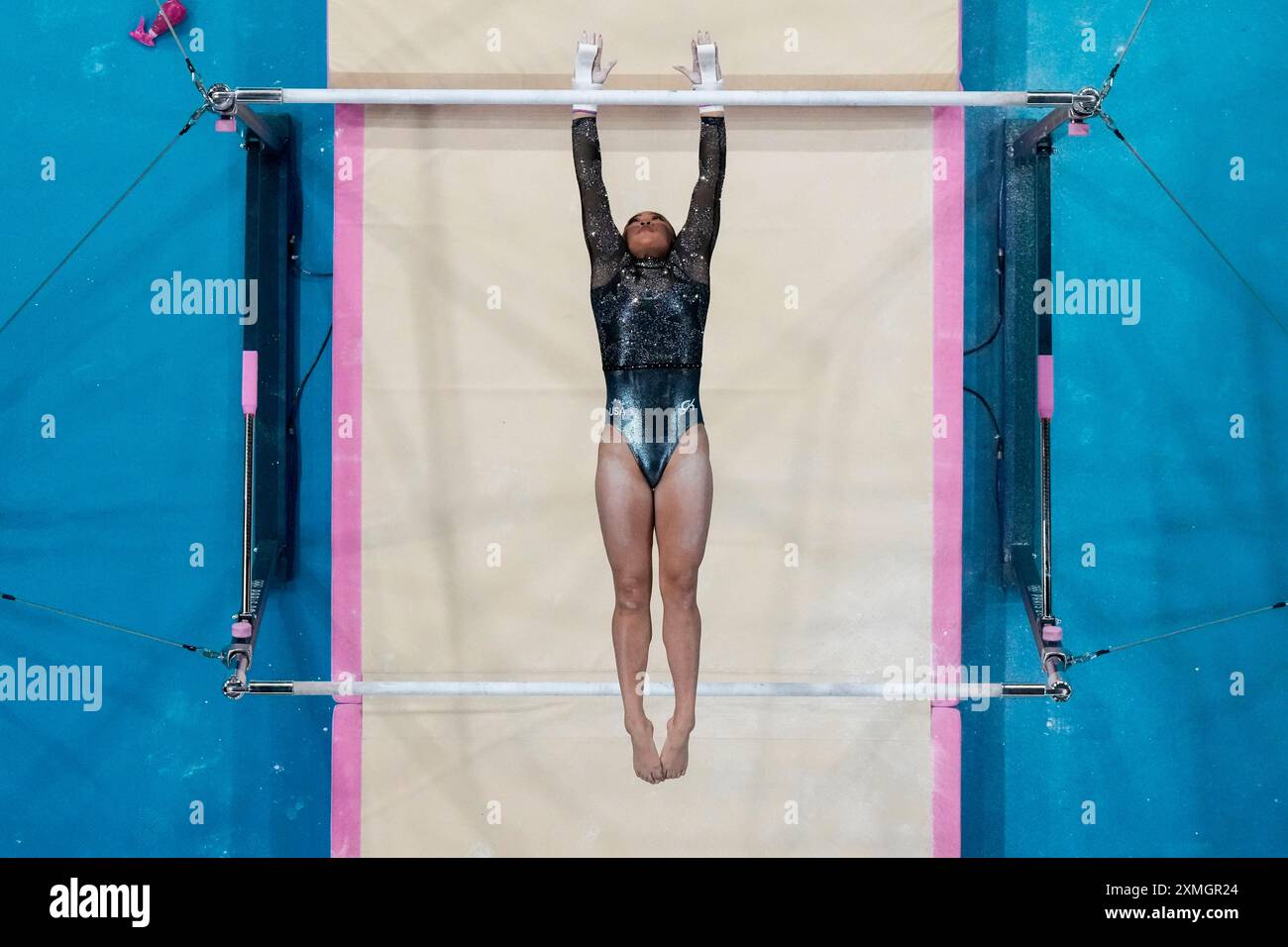 Sunisa Lee, of United States, performs on the uneven bars during a ...