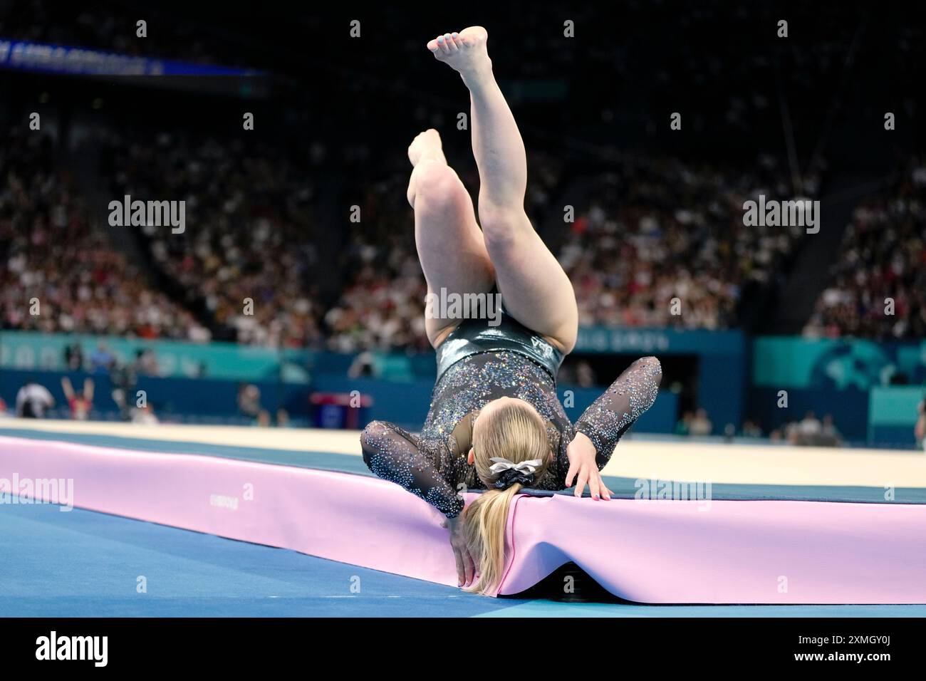 Jade Carey, of United States, falls as she competes on the floor ...
