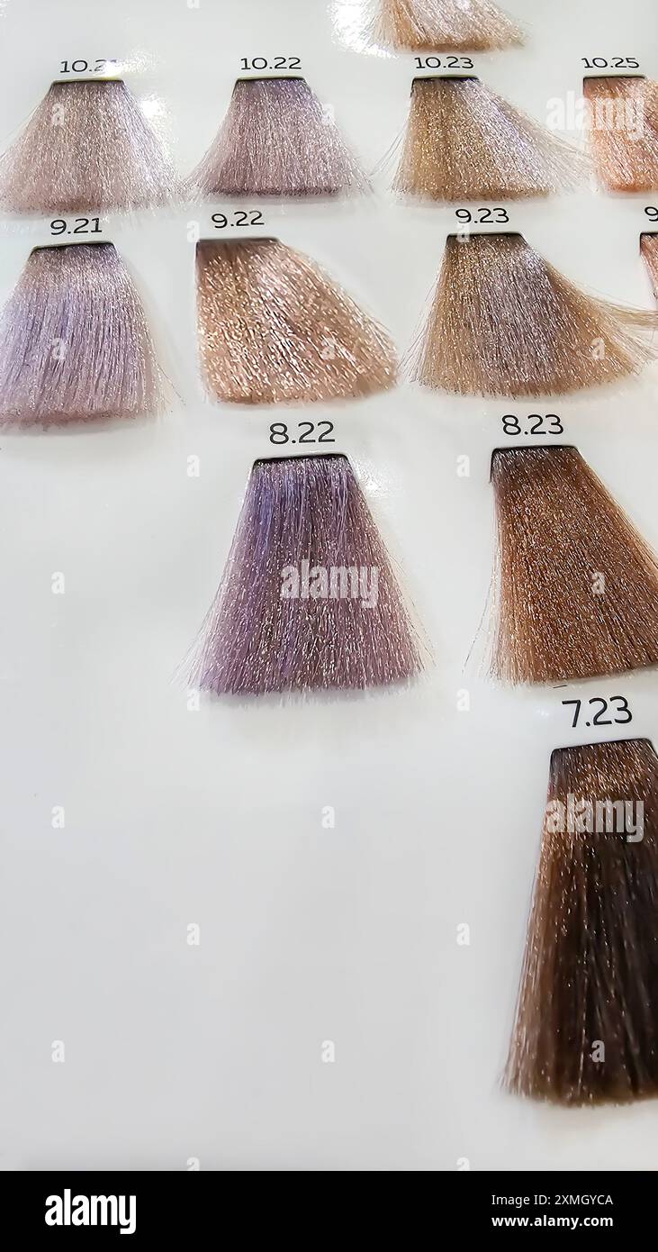 A palette of hair colors made from artificial strands on a white ...