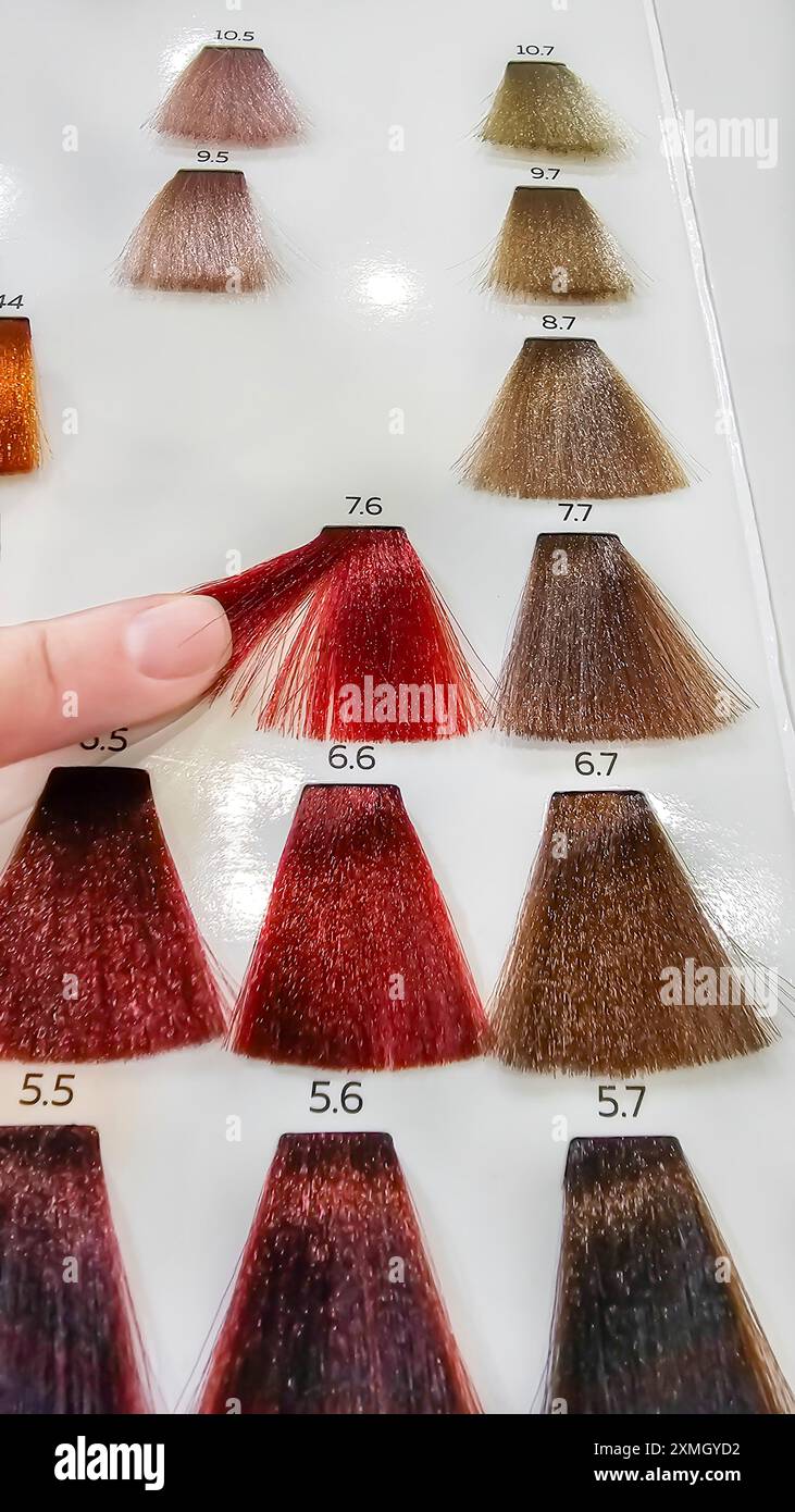 A palette of hair colors made from artificial strands on a white ...