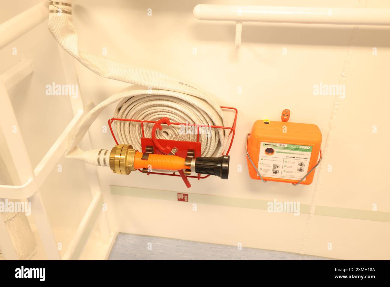 Rescue firefighter equipment, extinguisher, ax and fire line in red box ...