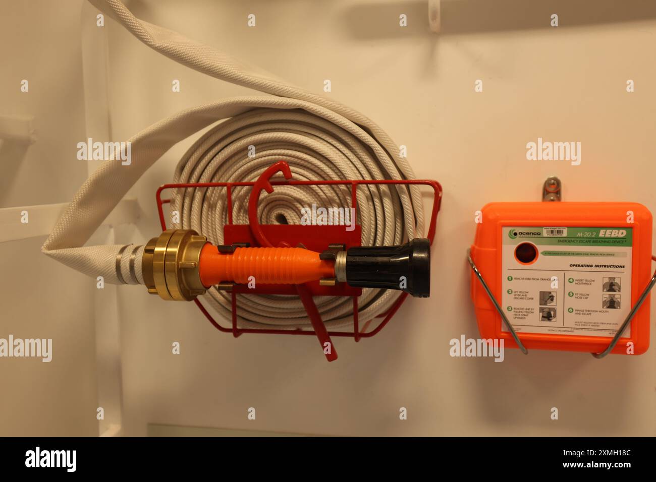 Rescue firefighter equipment, extinguisher, ax and fire line in red box ...