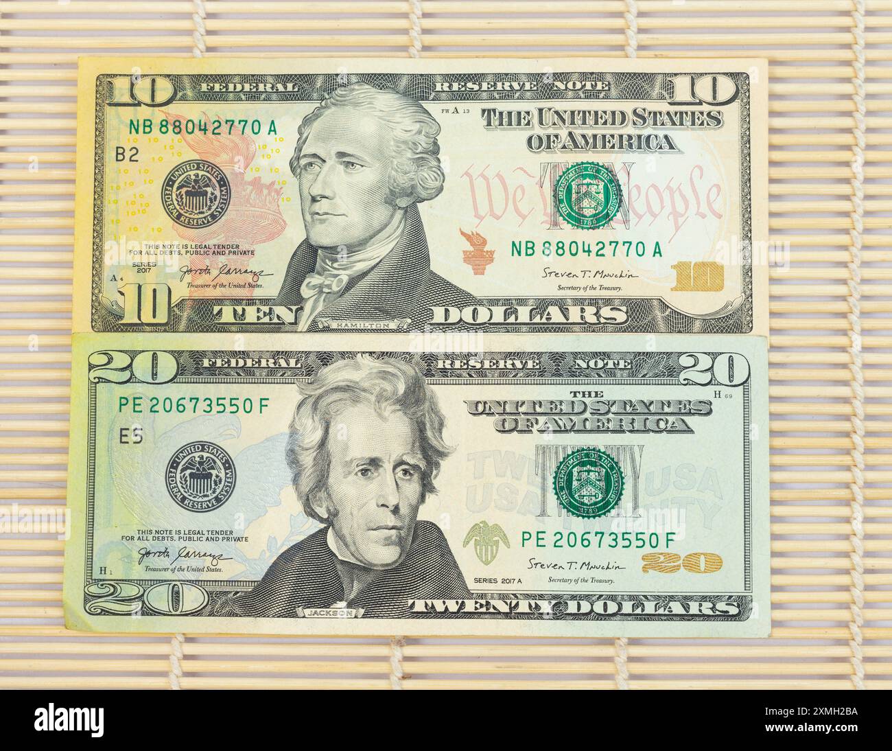 Ten and Twenty-Dollar Bills with Curry Stains on Edges Isolated on ...