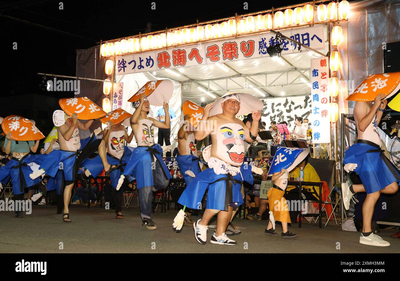People perform the belly button dance during the Hokkai Belly Button ...