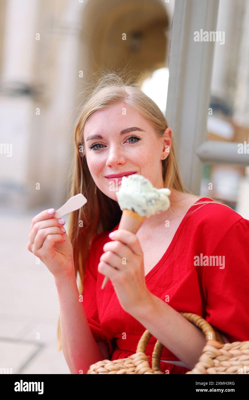 Girl walking eating ice cream on hi-res stock photography and images ...