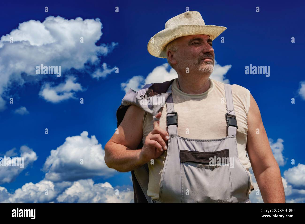 Man wearing blue overalls hi-res stock photography and images - Alamy