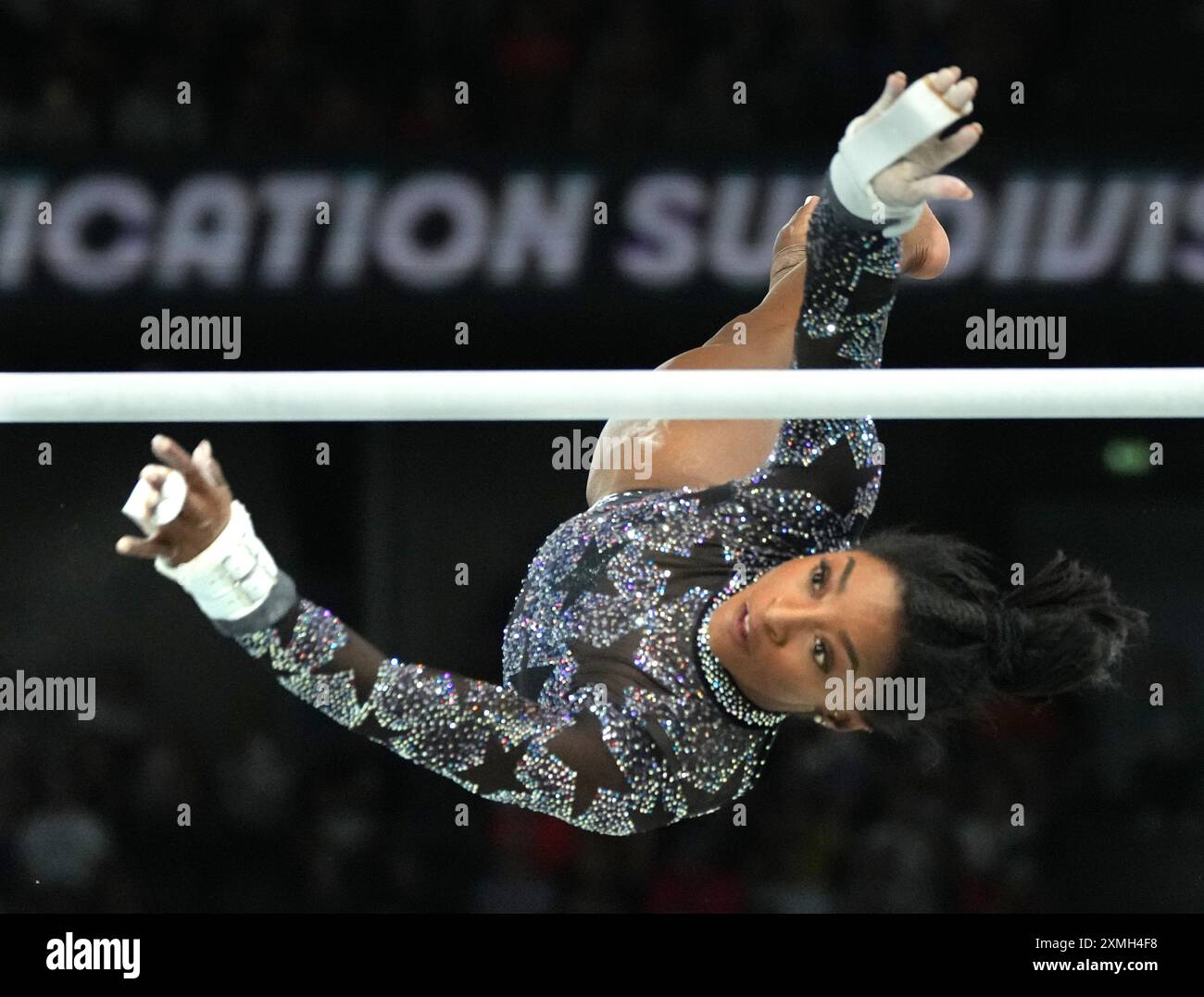 Paris, France. 28th July, 2024. USA's Simone Biles turns and reaches ...