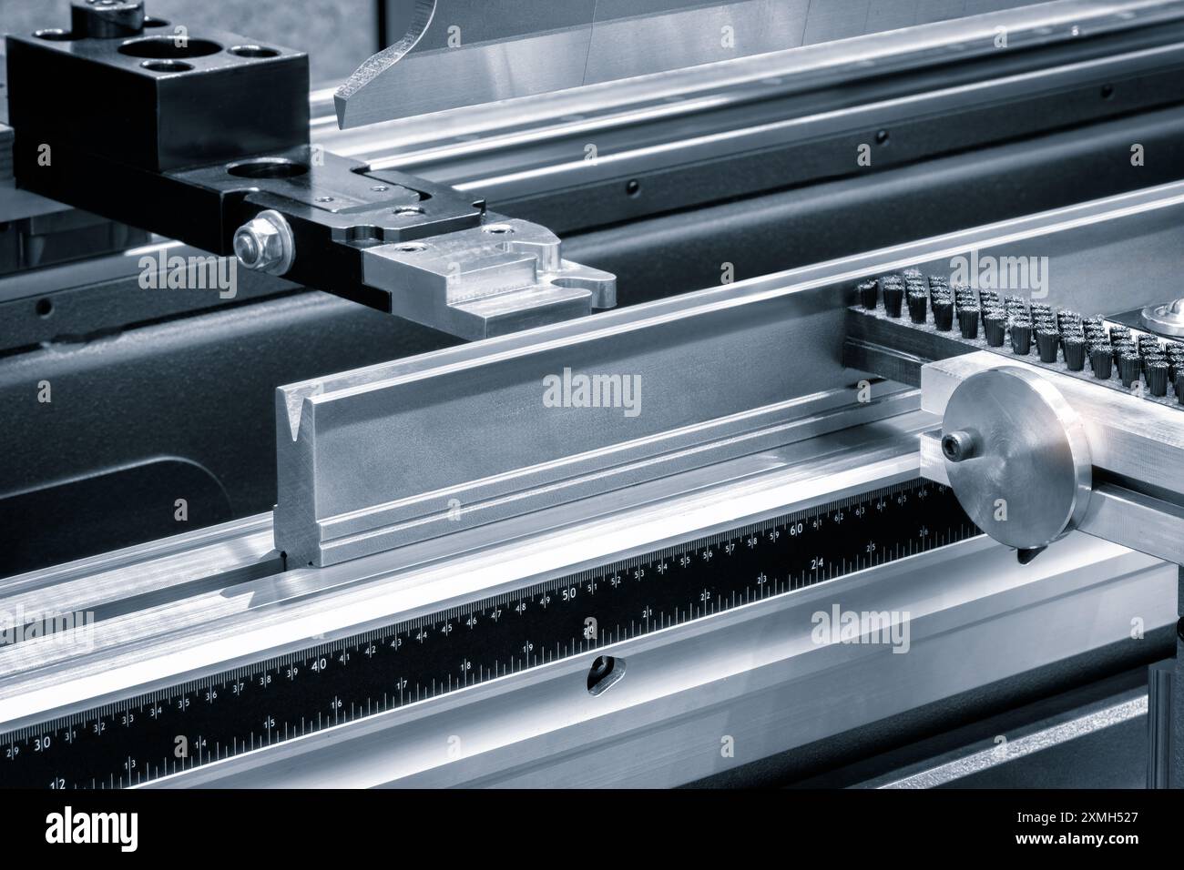 Bending sheet metal on hydraulic machine in factory. Industrial ...