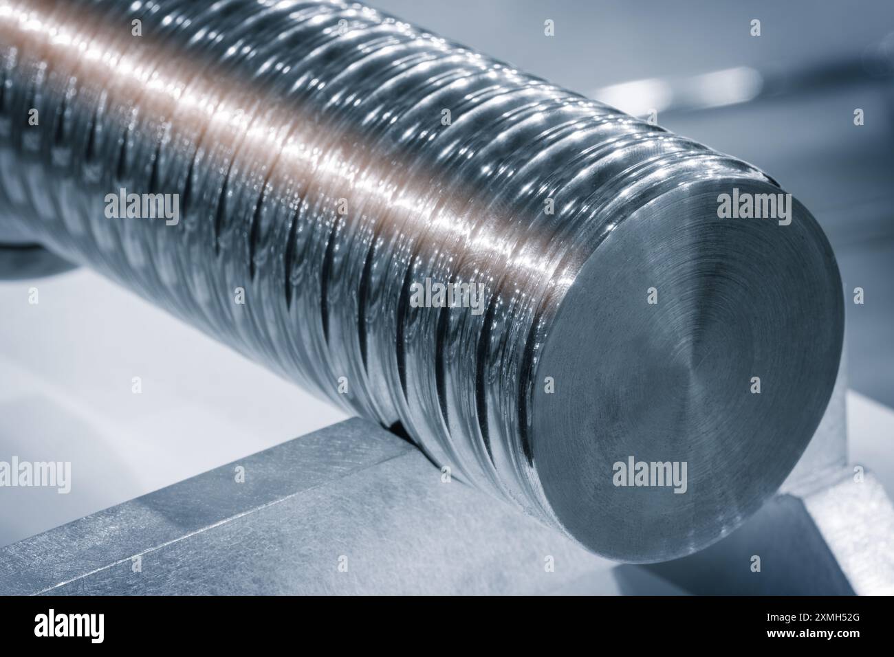 Close up of industrial metal screw shaft as part of screw transmission ...