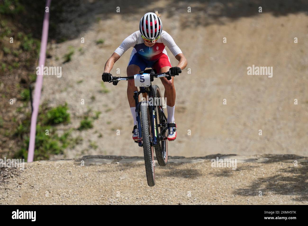 Loana Lecomte, of France, takes a jump as she competes in the women's ...