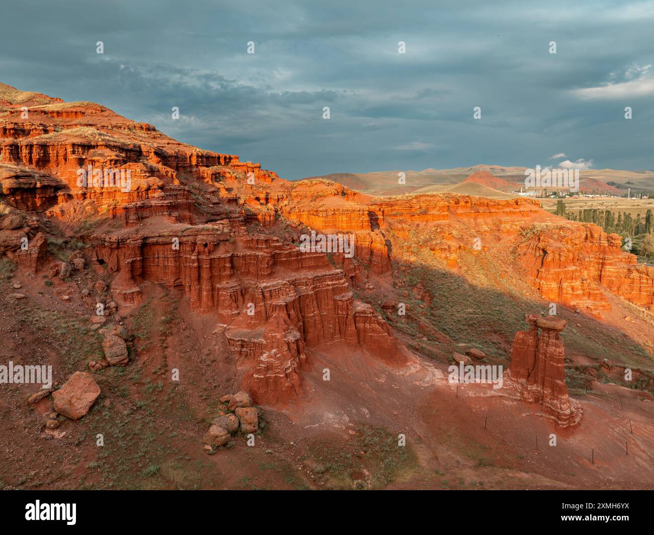 Red fairy chimneys shaped like formations that are millions of years ...