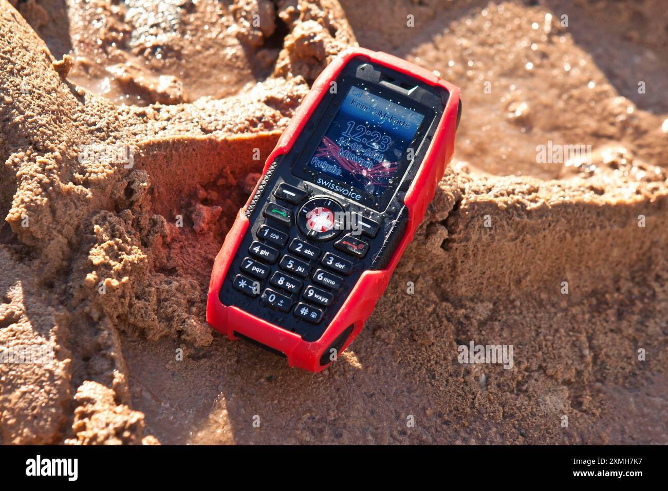 Photo of a Swiss Voice vintage mobile phone, released in 2011, in dirty surroundings Stock Photo ...
