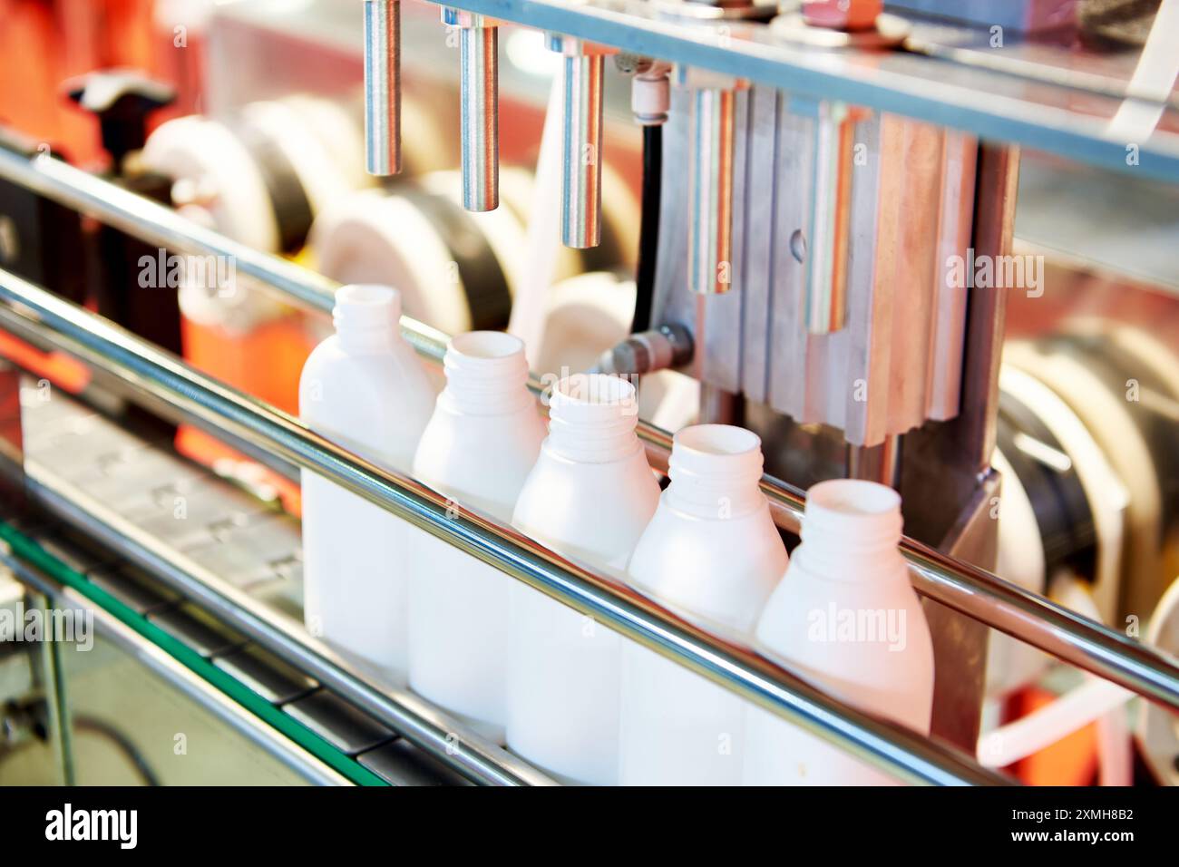 Industrial conveyor with plastic bottles on dispenser line Stock Photo ...