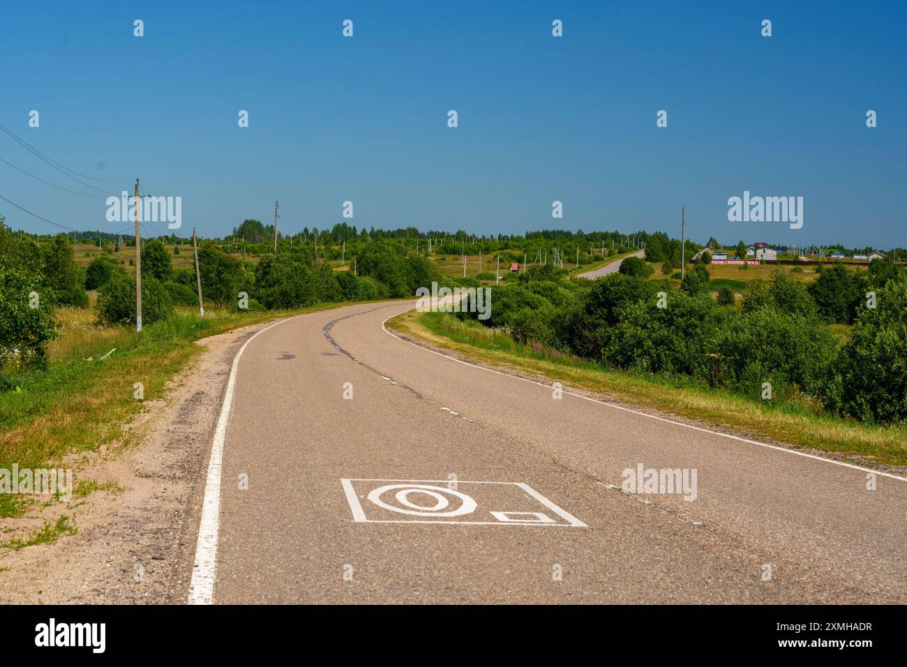 Rural asphalt road winding through the countryside Stock Photo - Alamy