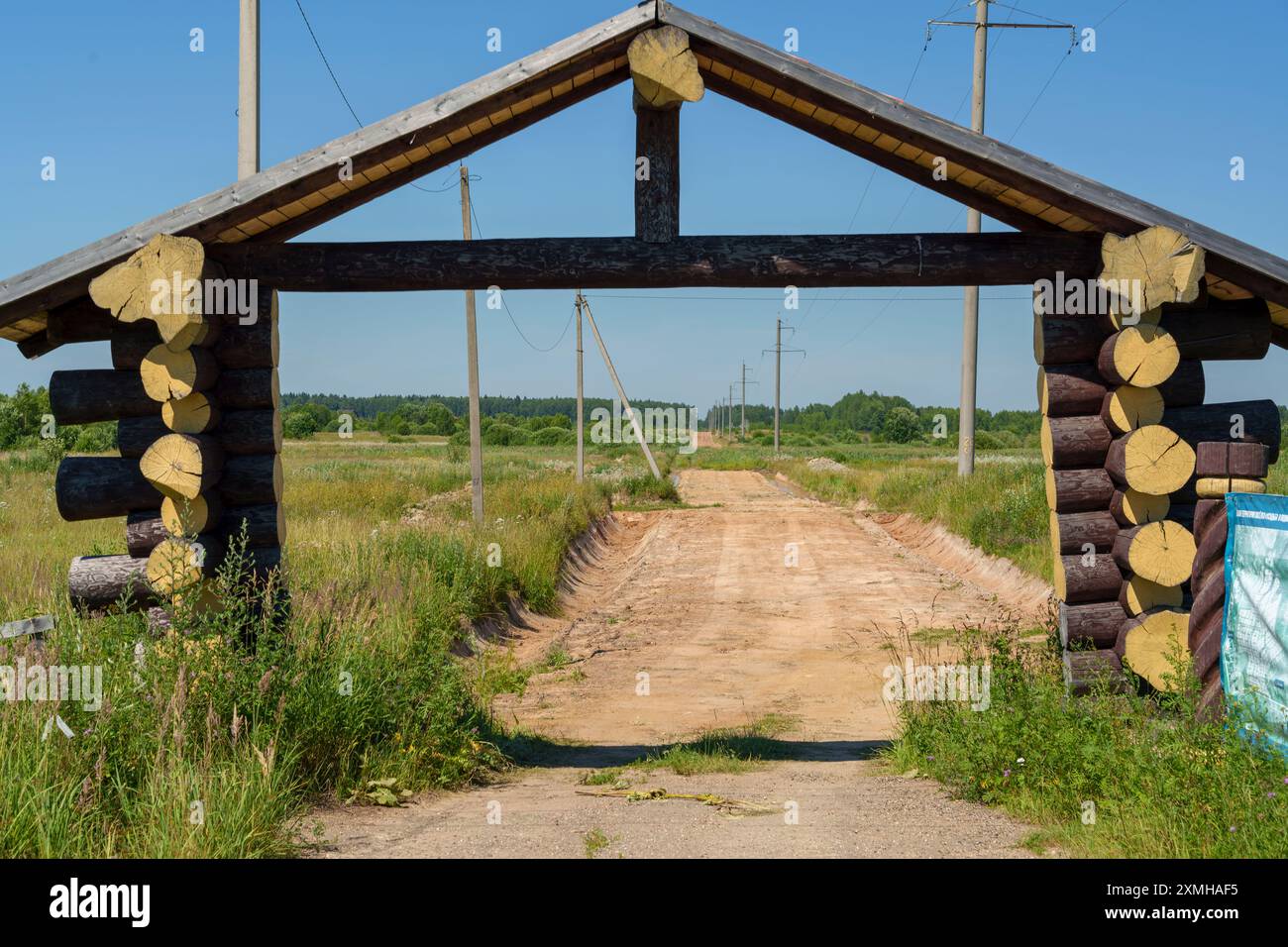 Rustic wooden gate over a dirt road in the countryside Stock Photo - Alamy