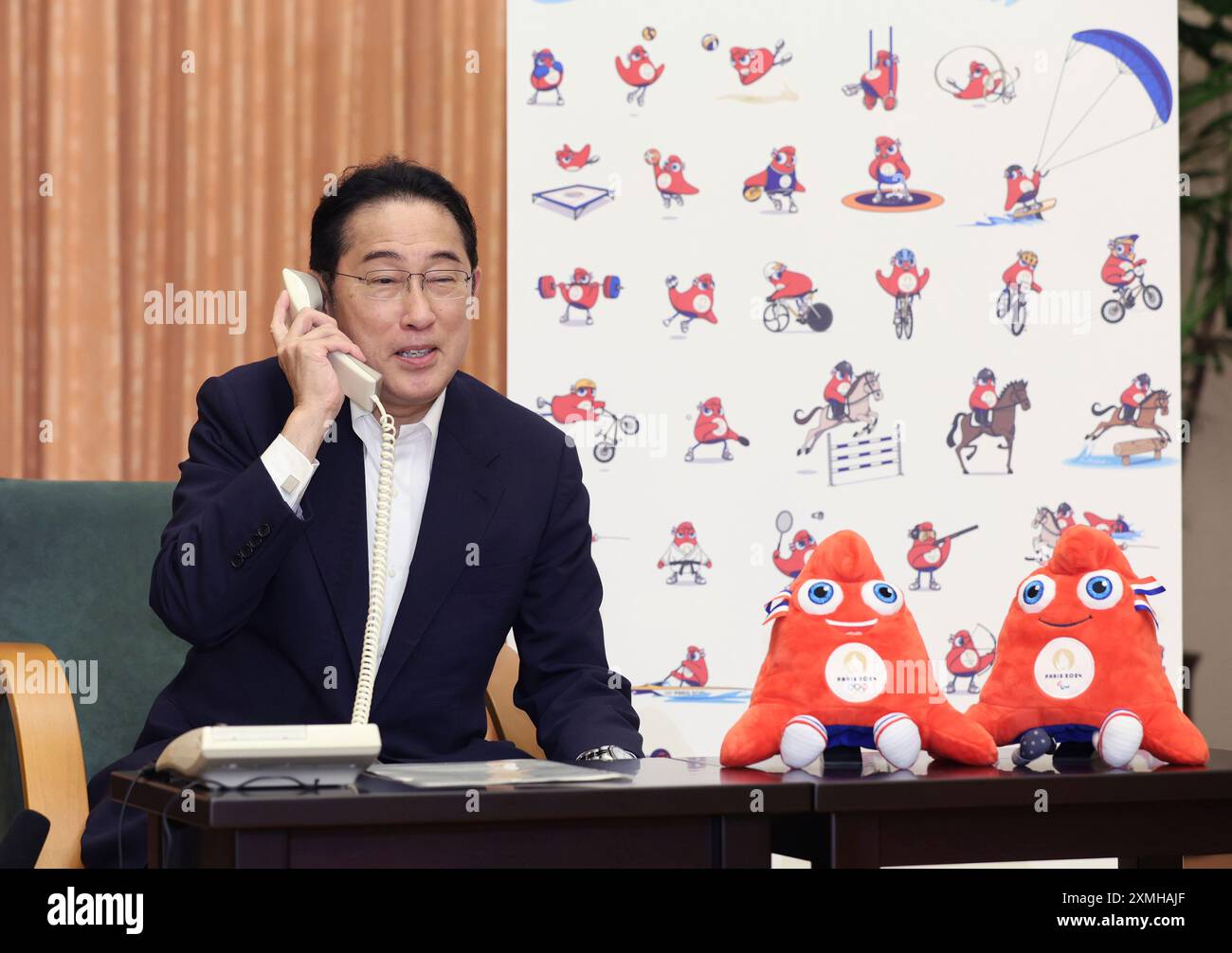 Japanese Prime Minister Fumio Kishida talks on the phone with Natsumi Tsunoda, who won the gold ...