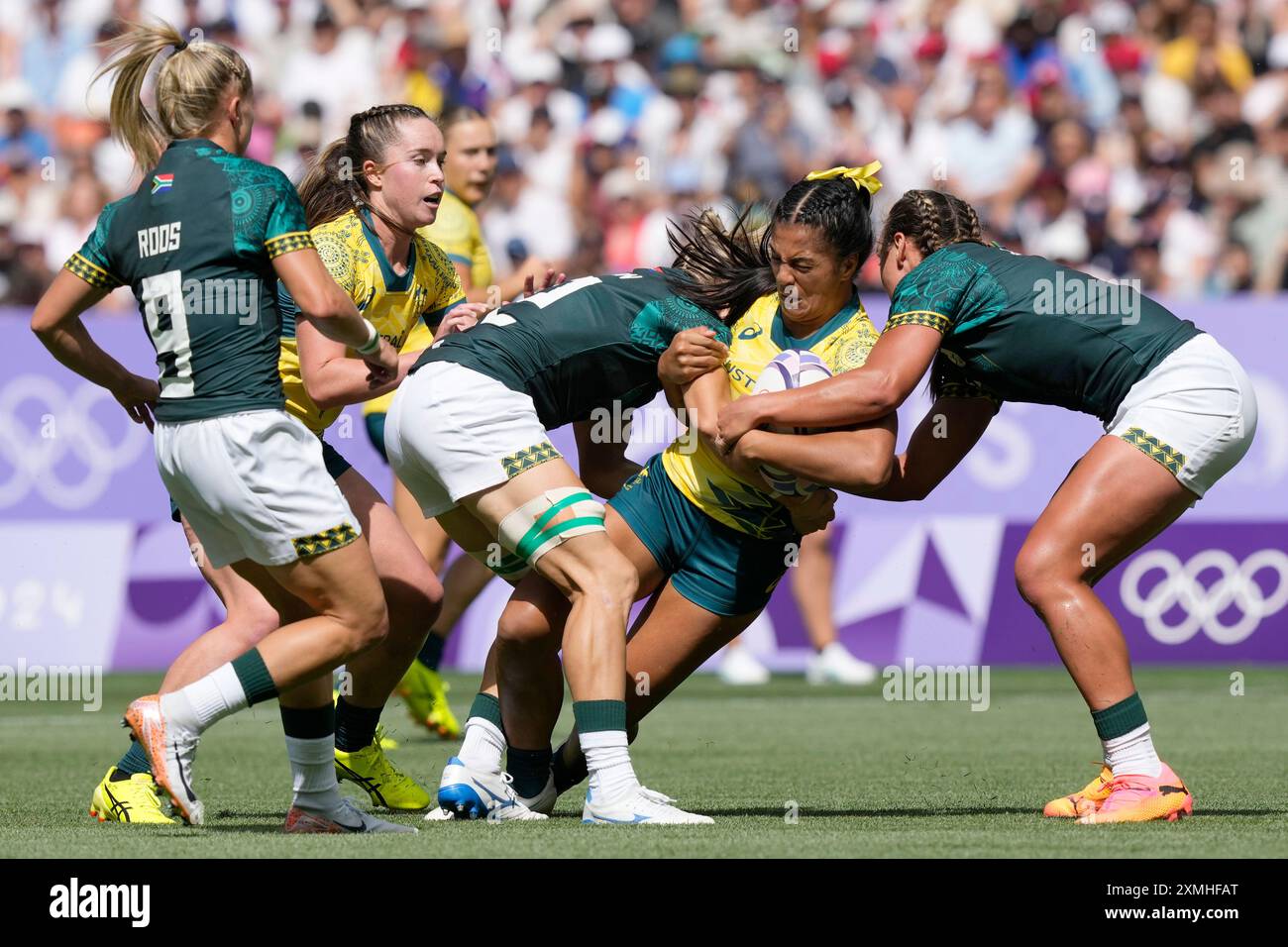 Australia's Sarah Maki is brought down by South Africa's Liske Lategan ...