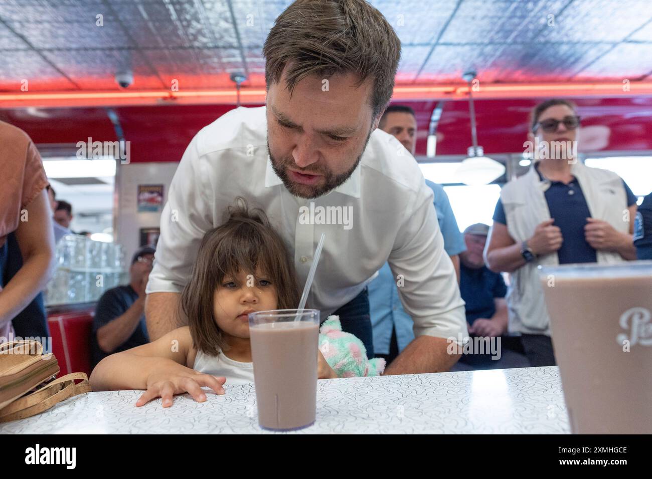 Republican vice presidential candidate Sen. JD Vance, R-Ohio, helps his ...