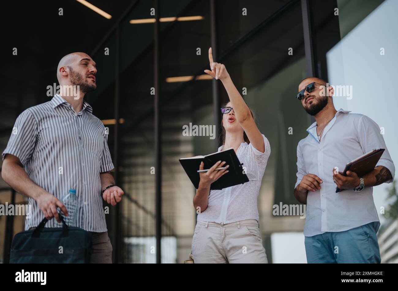 Businesspeople having a discussion during an outdoor meeting in an ...