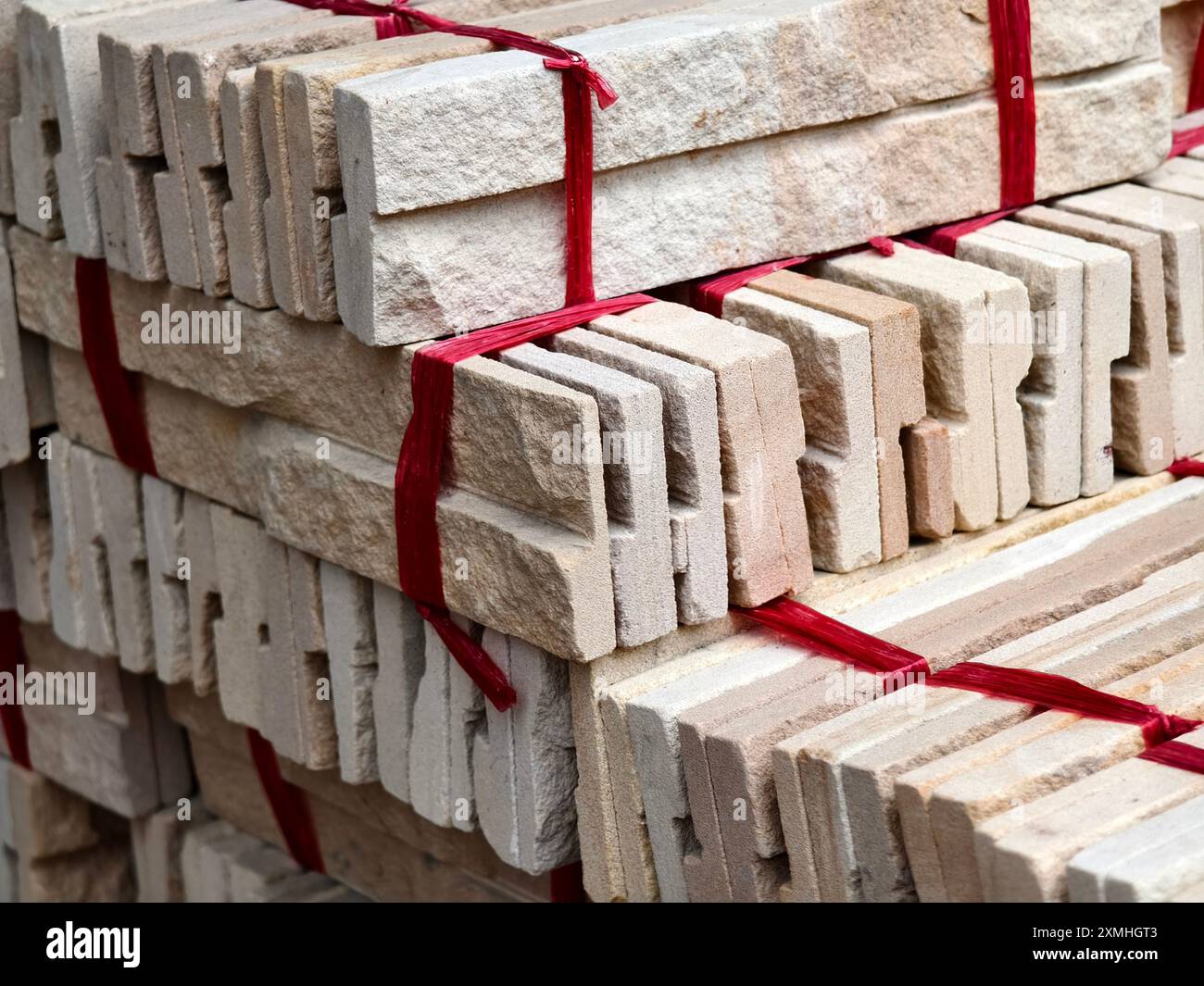 Brick stack tied with ropes for construction and building purposes ...