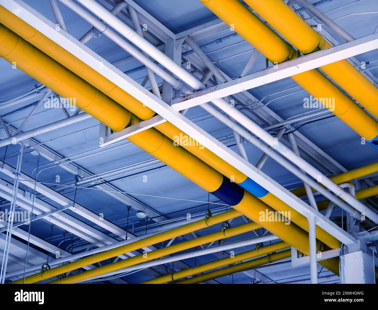Ceiling with ventilation pipes and lights in industrial building Stock ...