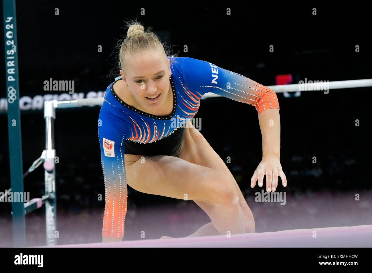 Lieke Wevers, of Netherlands, falls on landing on the uneven bars ...
