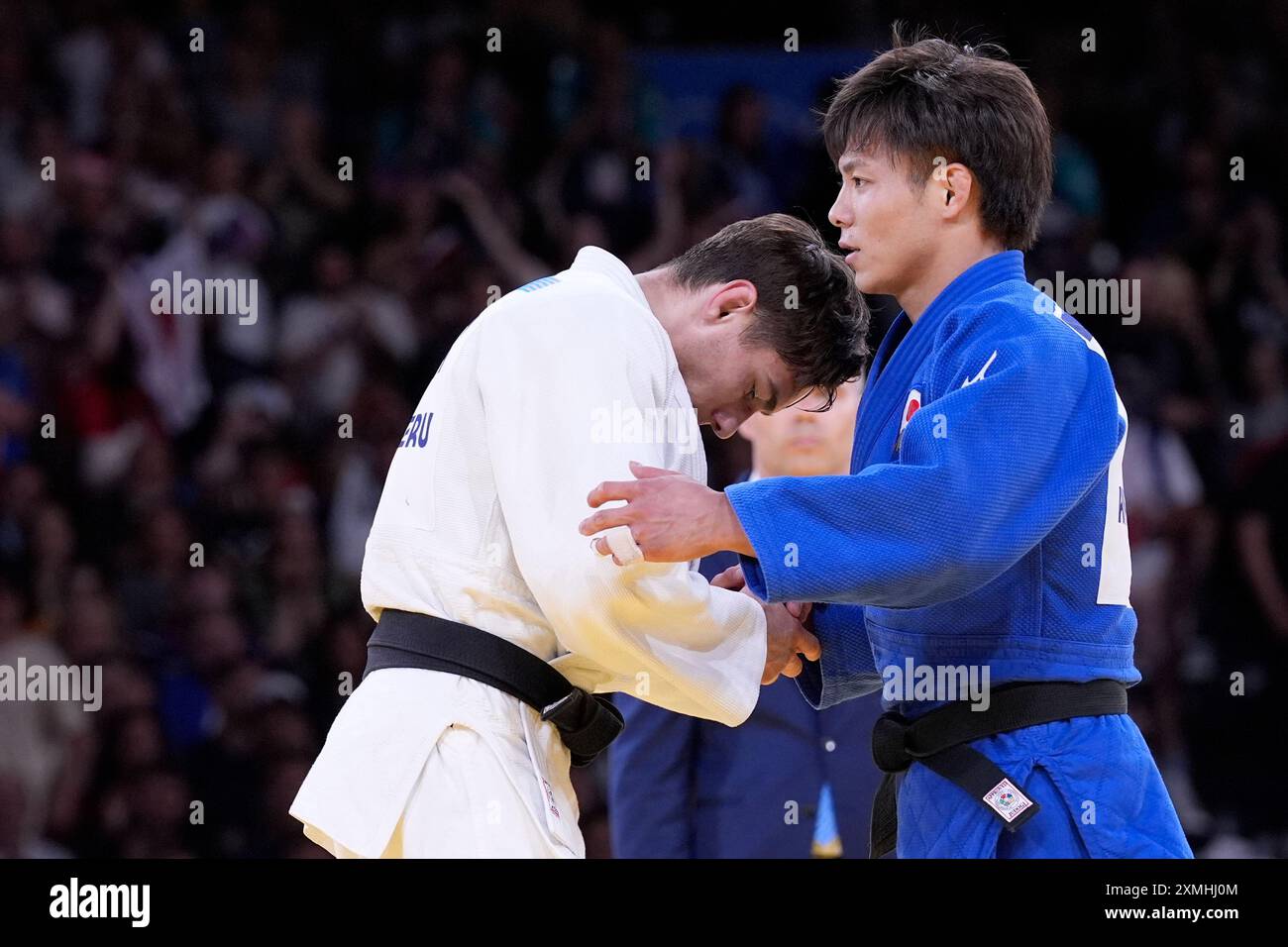 Moldova's Denis Vieru and Japan's Hifumi Abe, right, shake hands after ...