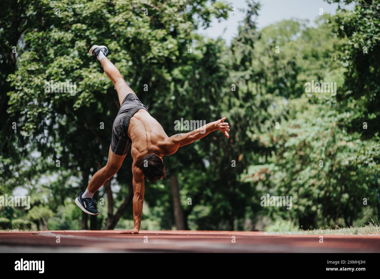 Man performing acrobatic handstand hi-res stock photography and images ...