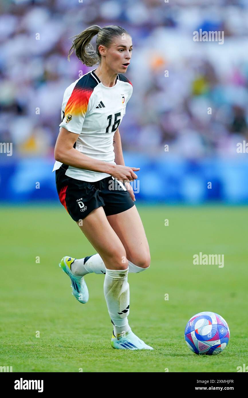 Jule Brand (Germany, 16)n controls the ball during the Olympic Games ...