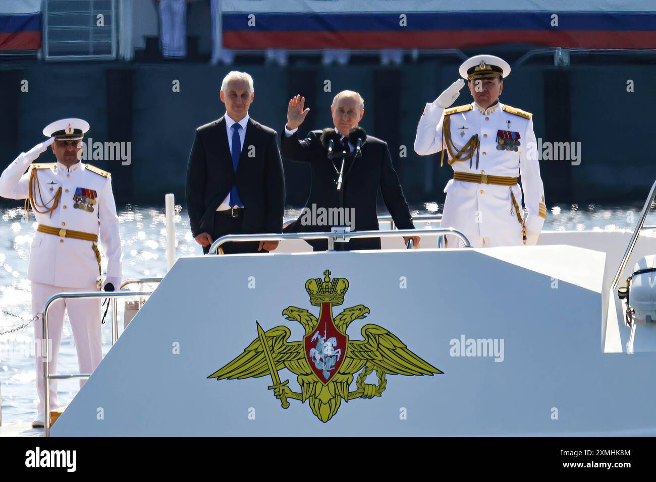 Russian President Vladimir Putin (center) takes part in a naval parade ...
