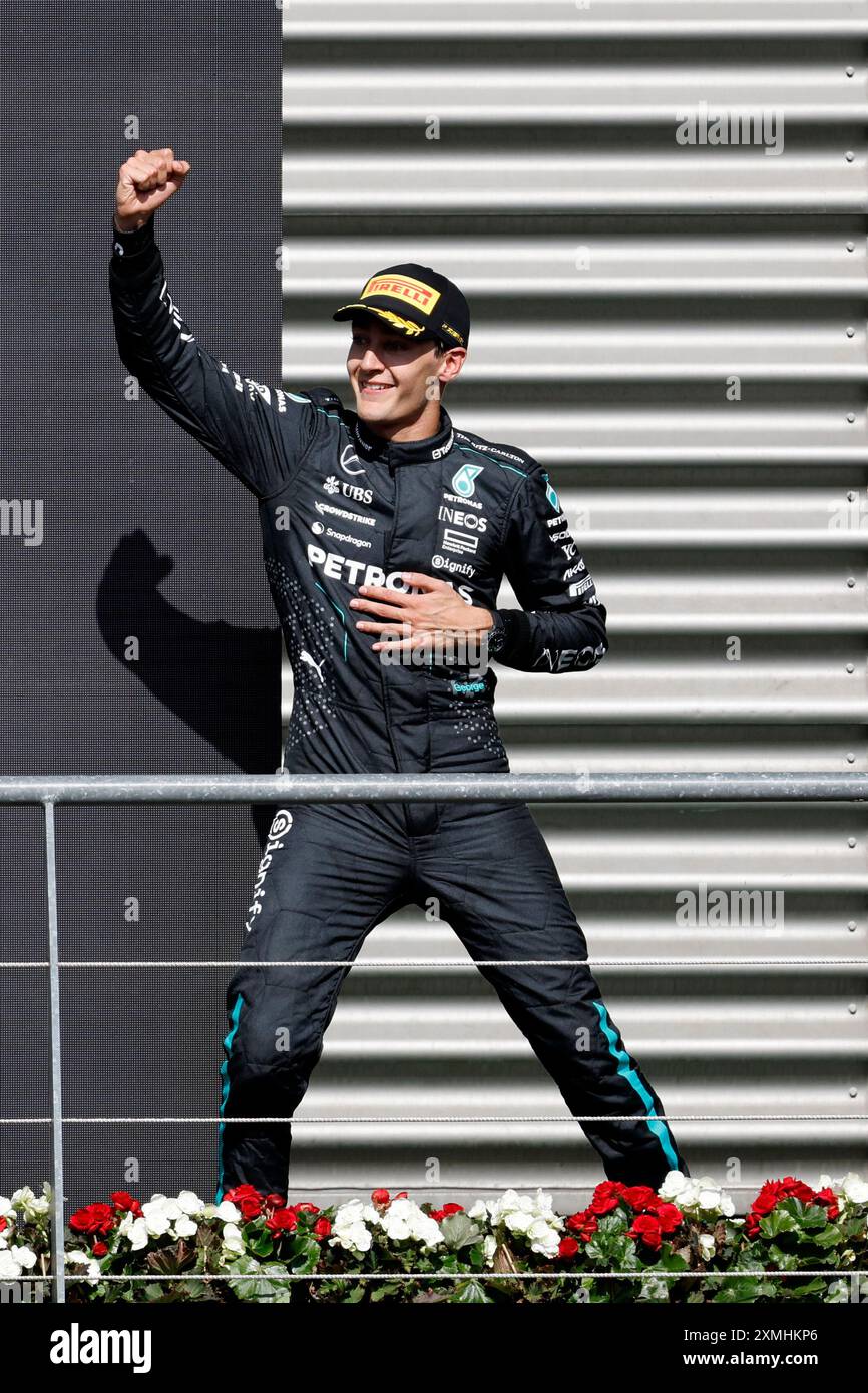 First place, Mercedes driver George Russell of Britain, celebrates on ...