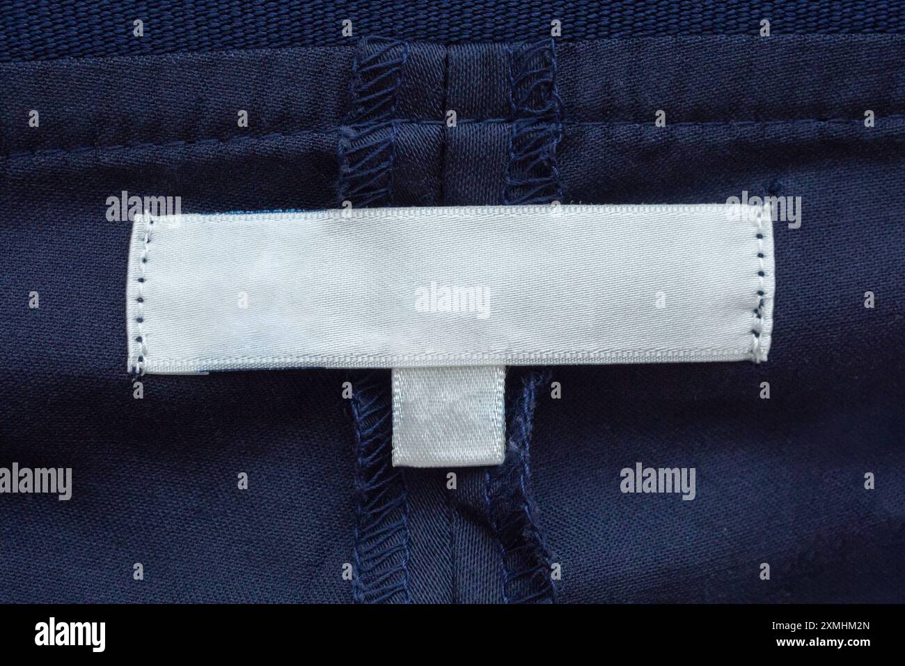 Blank white clothes label close up Stock Photo - Alamy